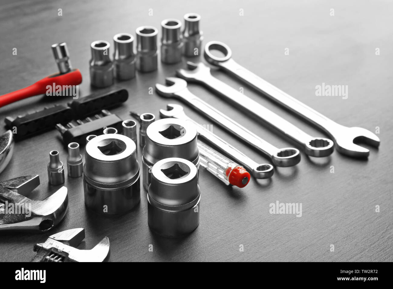 Setting of tools for car repair on grey table Stock Photo - Alamy
