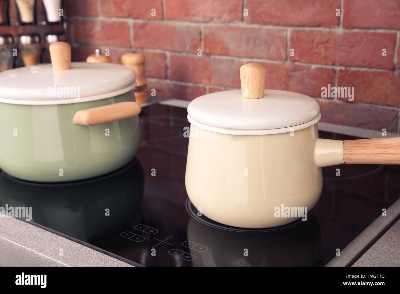 Kitchenware for cooking classes on electric stove Stock Photo - Alamy