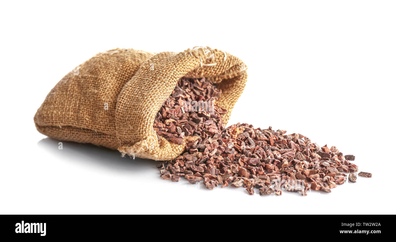 Textile sack with cocoa nibs on white background Stock Photo - Alamy