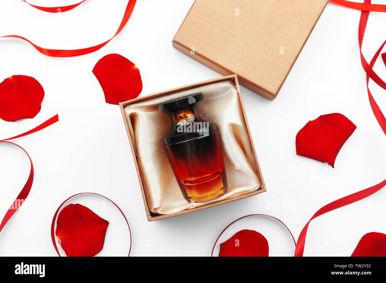 Perfume in present box on white background Stock Photo - Alamy
