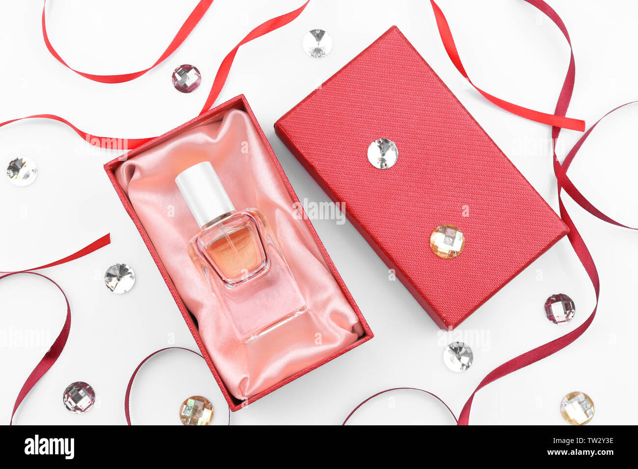 Perfume in present box on white background Stock Photo - Alamy