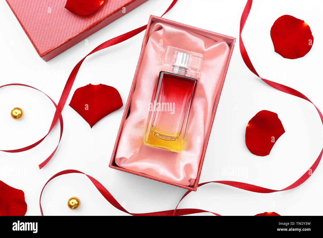 Perfume in present box on white background Stock Photo - Alamy
