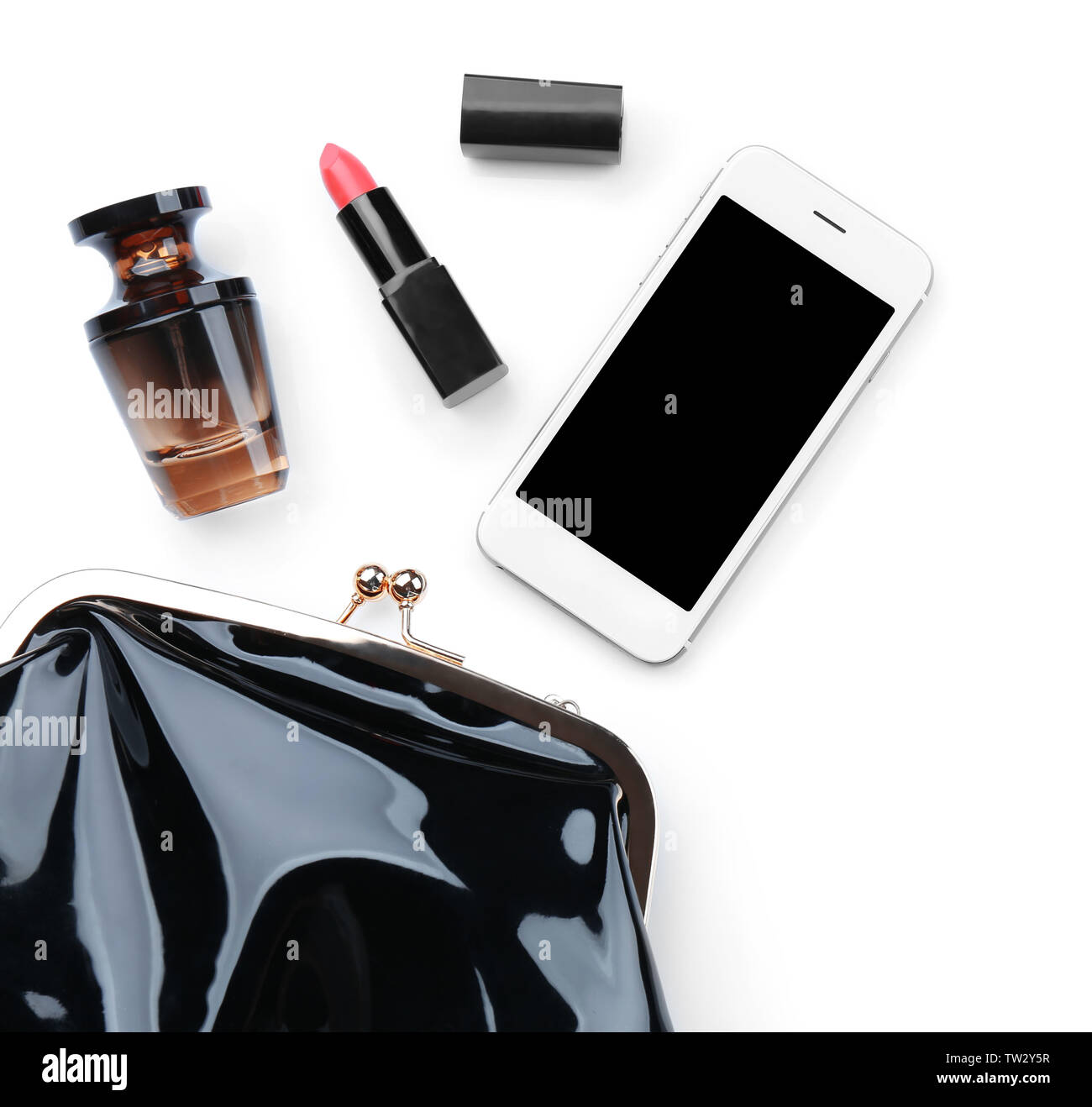 Perfume bottle with cosmetic bag and phone on white background Stock ...