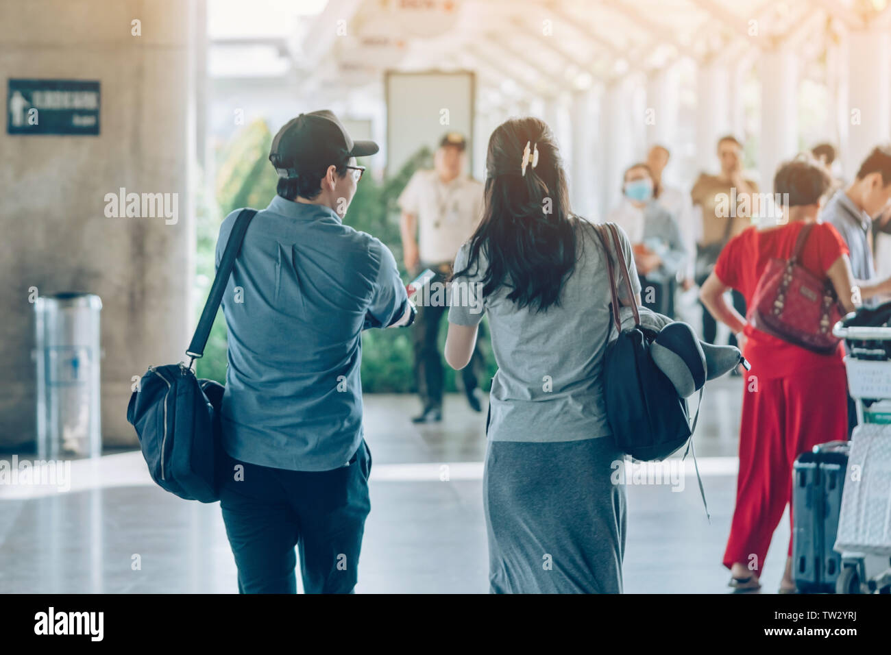 Passengers walk to wait for the car to pick up at airport arrival ...