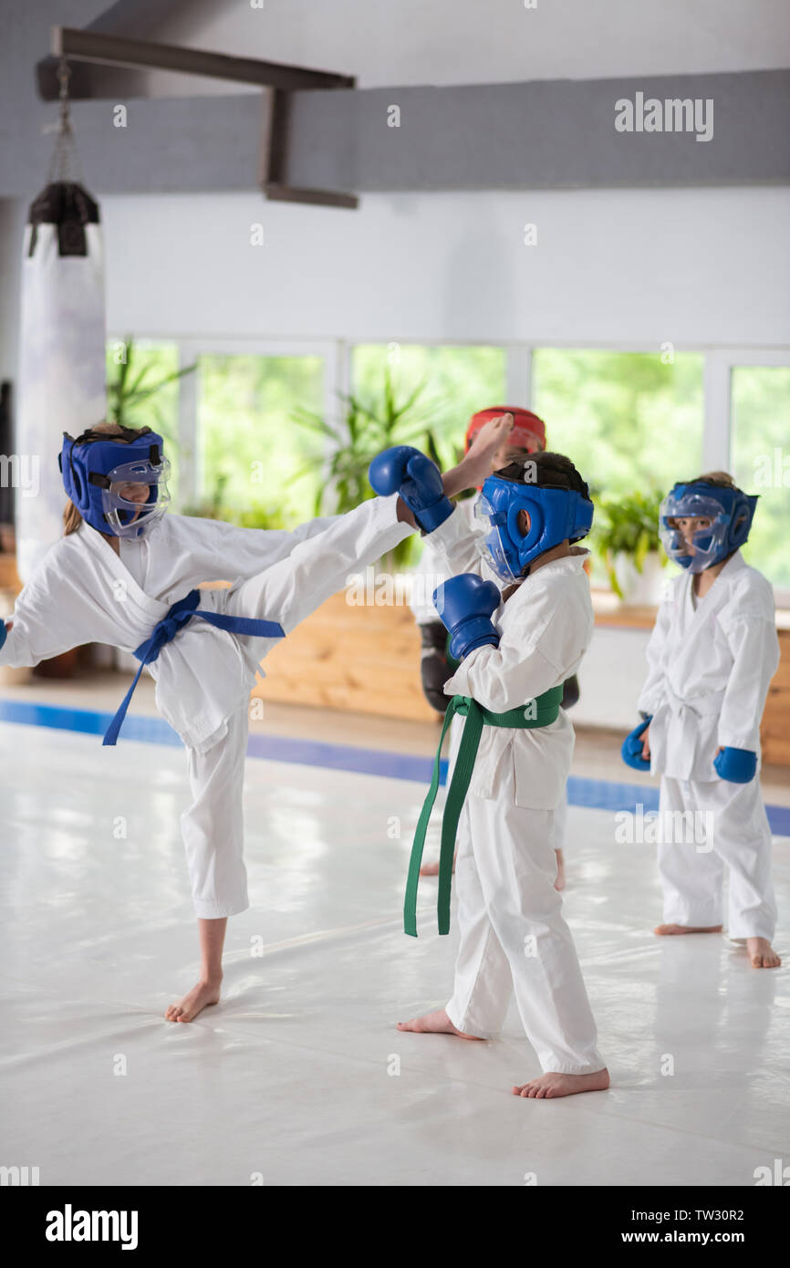 Fight time. Active talented boys and girl having a fight while studying ...