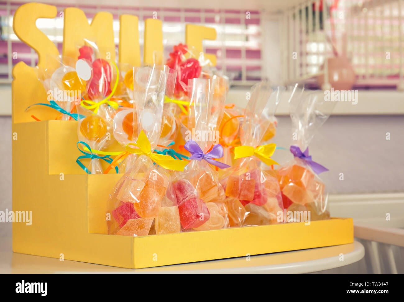 Sweets on stand at candy shop Stock Photo - Alamy