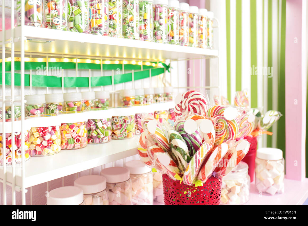 Different sweets on counter at candy shop Stock Photo - Alamy