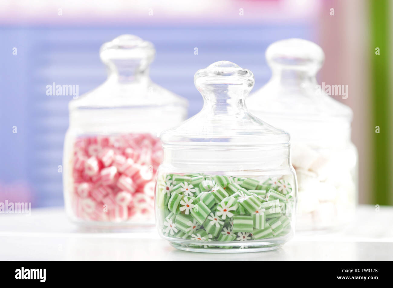Different sweets in jars at candy shop Stock Photo - Alamy