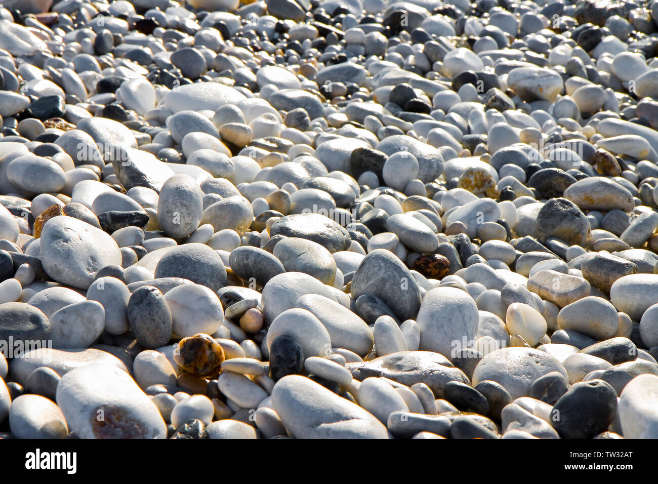 Background with white and gray stones softly rounded Stock Photo - Alamy
