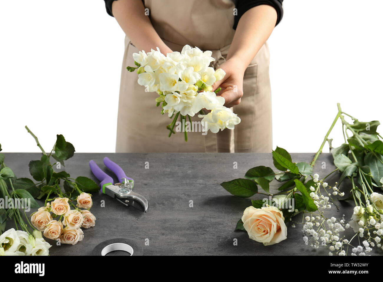 Female florist making beautiful bouquet at flower shop Stock Photo - Alamy