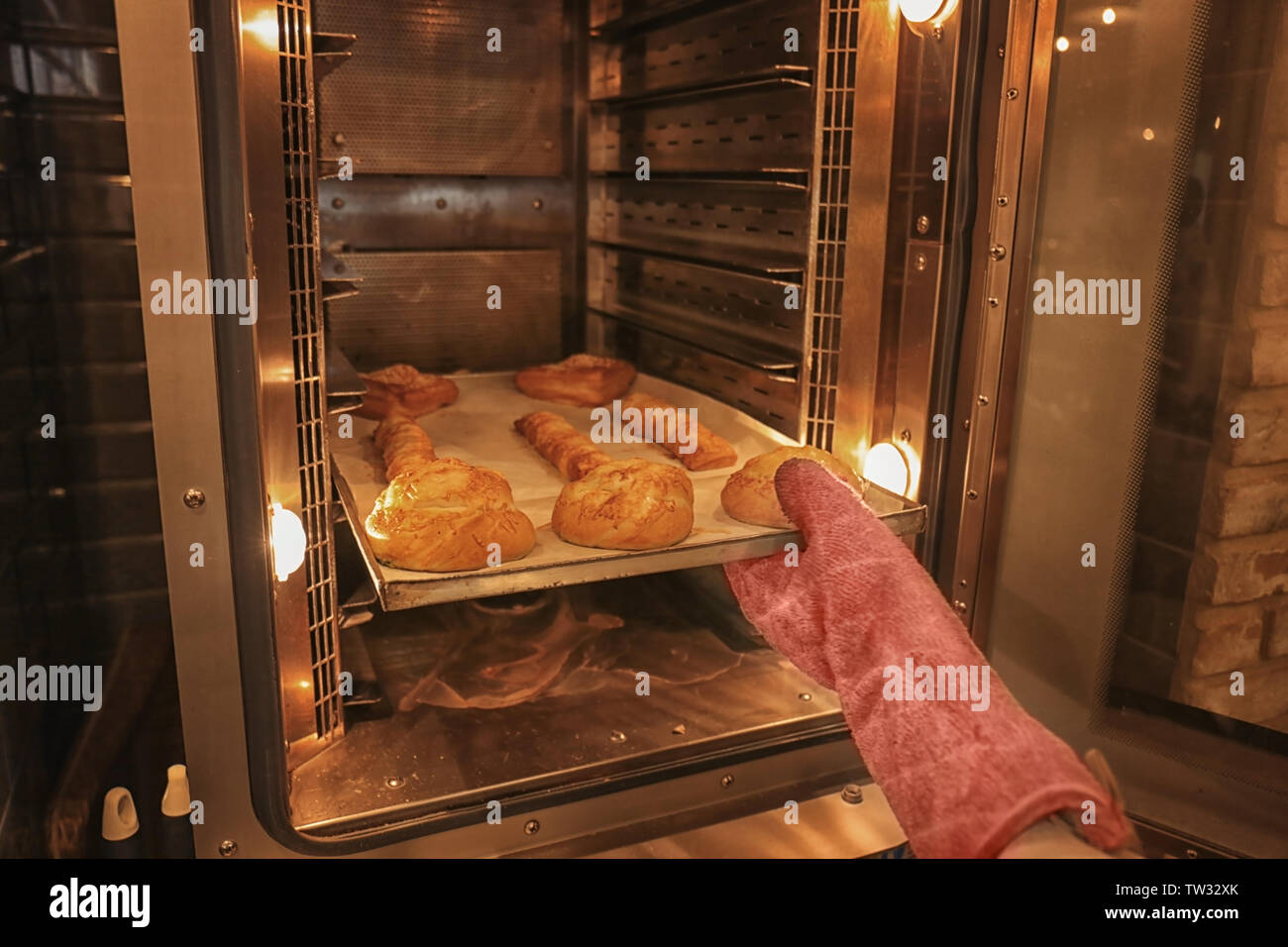 Female baker holding puff hi-res stock photography and images - Alamy