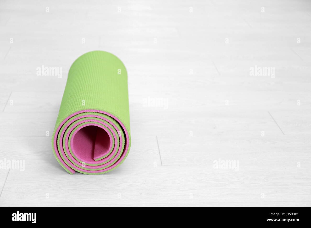 Rolled up yoga mat hi-res stock photography and images - Alamy
