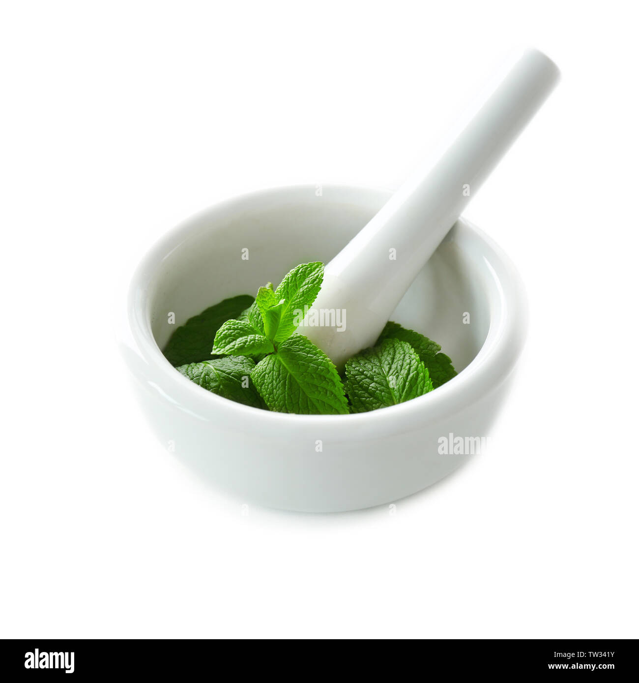 Mortar with leaves of lemon balm on white background Stock Photo - Alamy