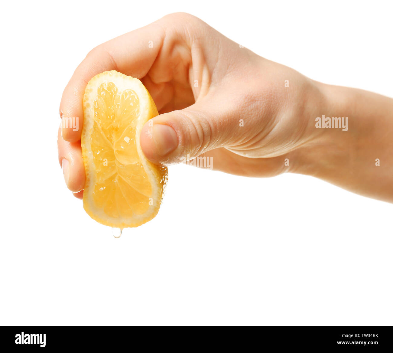 Female hand squeezing half of lemon on white background Stock Photo - Alamy