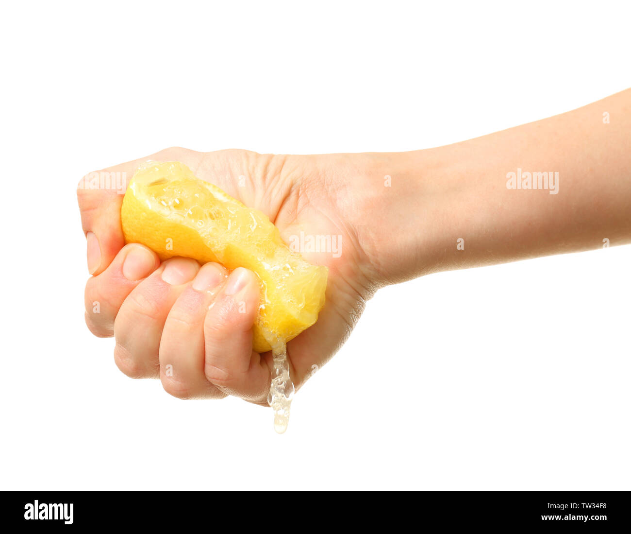 Female hand squeezing half of lemon on white background Stock Photo - Alamy