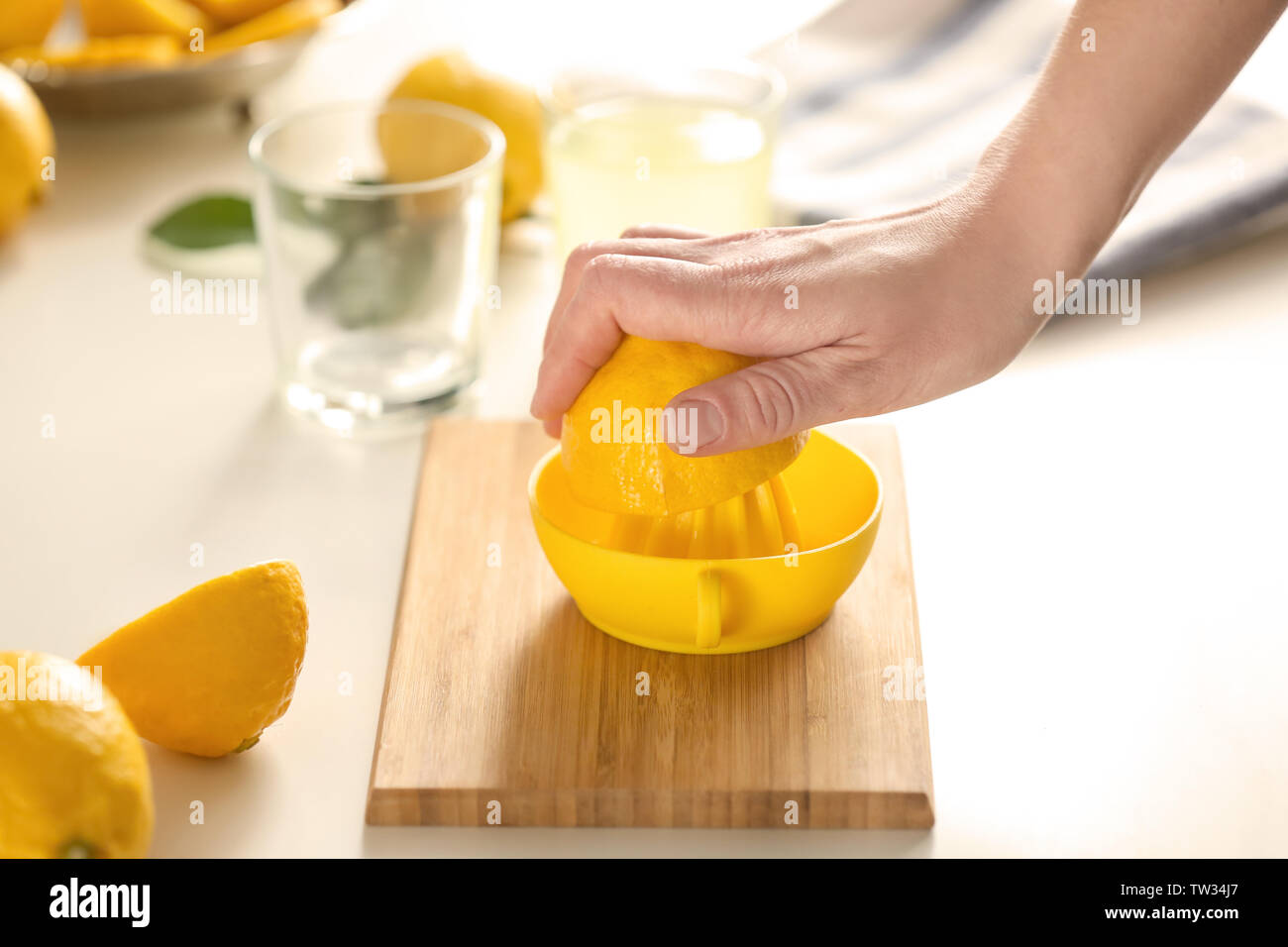 Hand of woman preparing lemonade in kitchen Stock Photo - Alamy