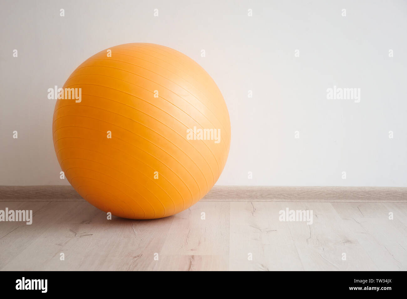 Rubber ball on floor indoors Stock Photo - Alamy