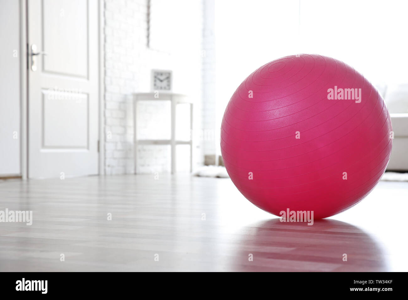 Rubber ball on floor indoors Stock Photo - Alamy