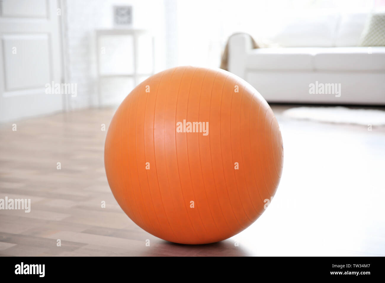 Rubber ball on floor indoors Stock Photo - Alamy