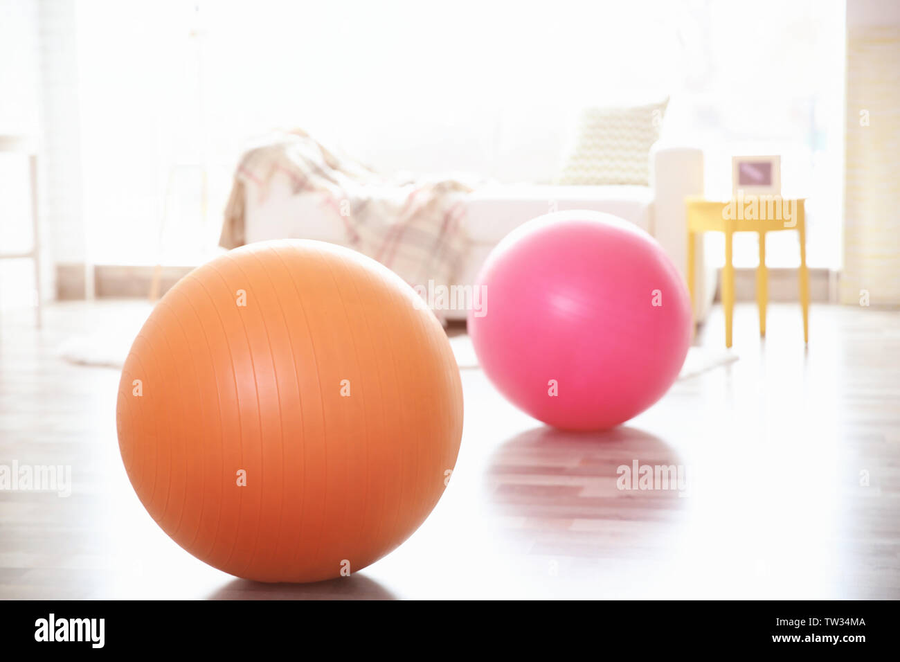 Rubber balls on floor indoors Stock Photo - Alamy