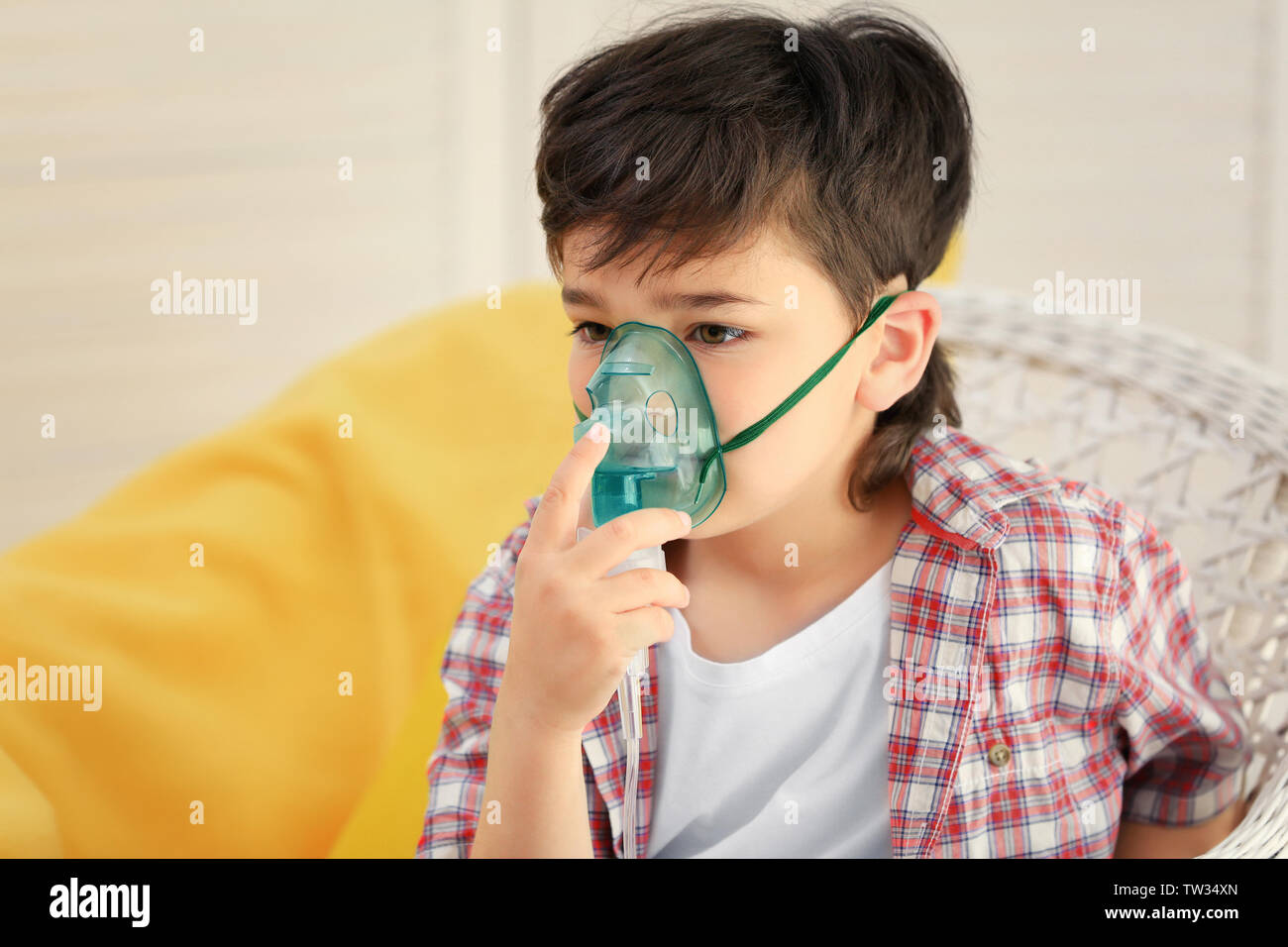 Boy using asthma machine at home Stock Photo - Alamy