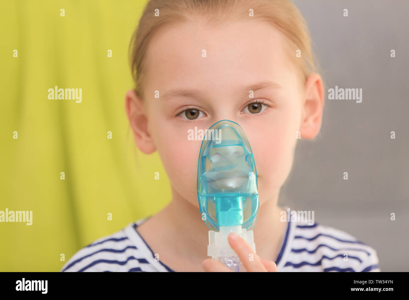Girl using asthma machine on blurred background Stock Photo - Alamy