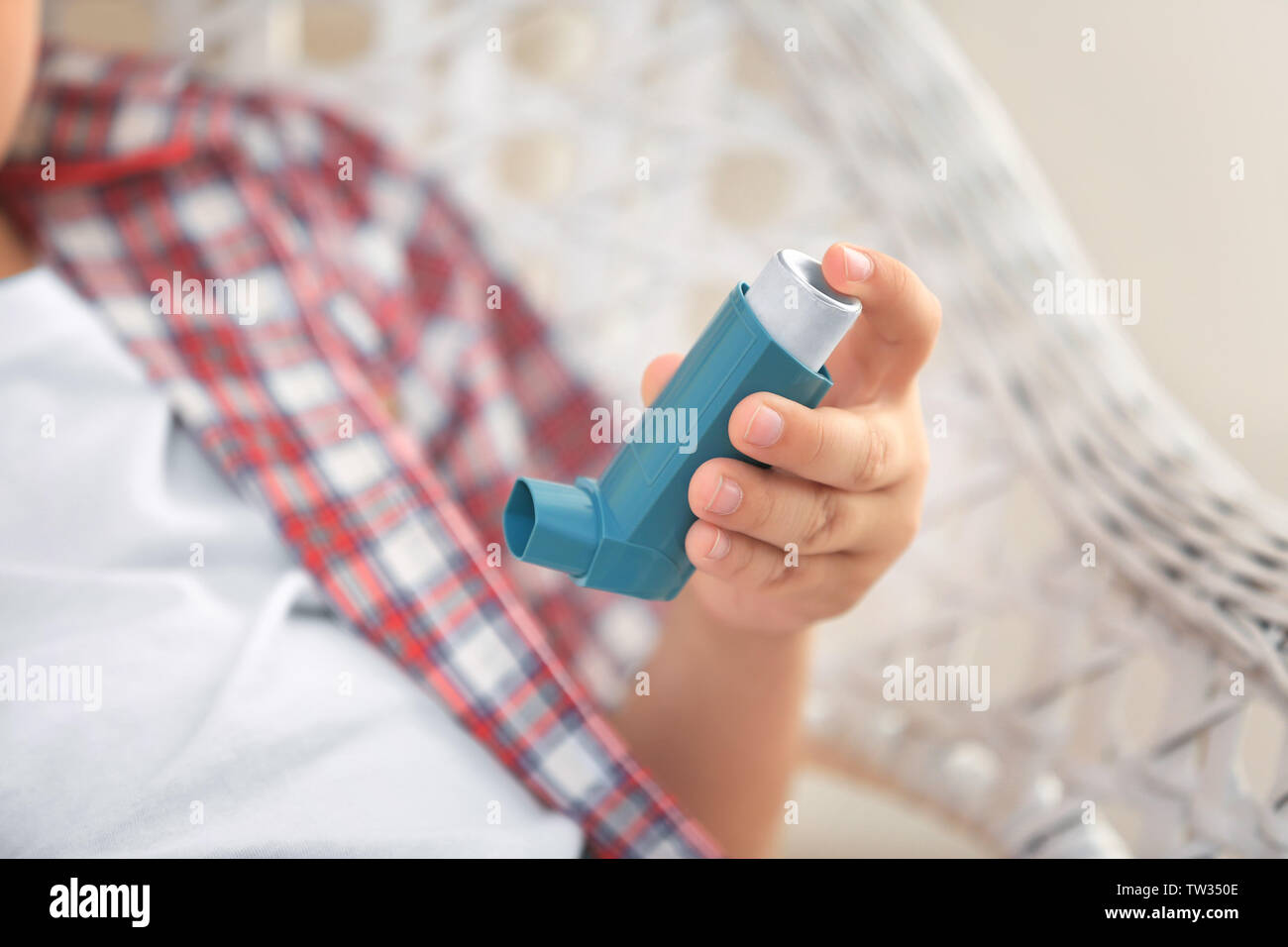 Boy with inhaler for asthma, closeup Stock Photo - Alamy