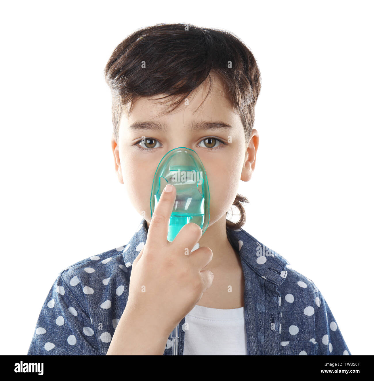 Boy using asthma machine on white background Stock Photo - Alamy