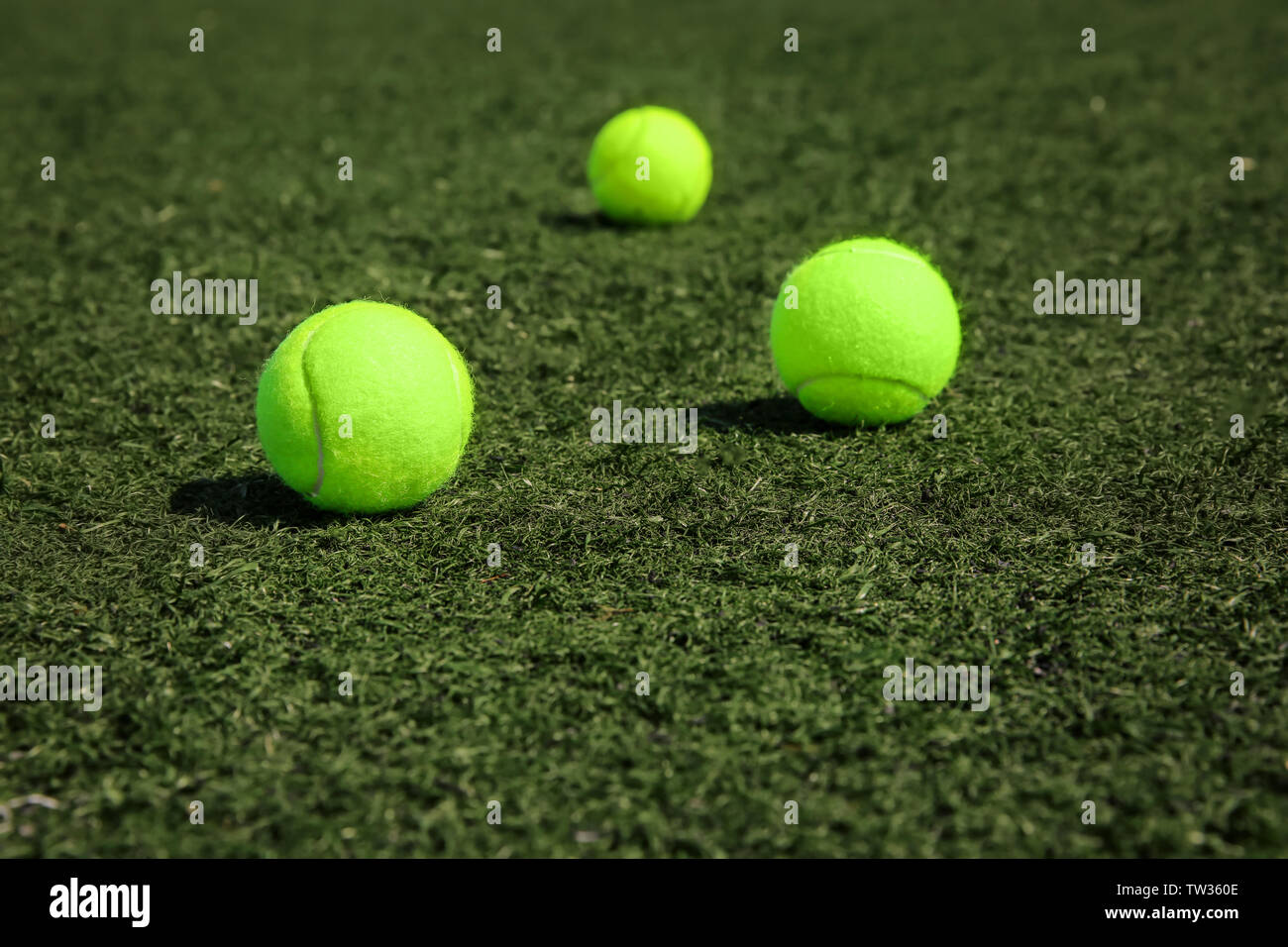 Tennis balls on artificial hi-res stock photography and images - Alamy