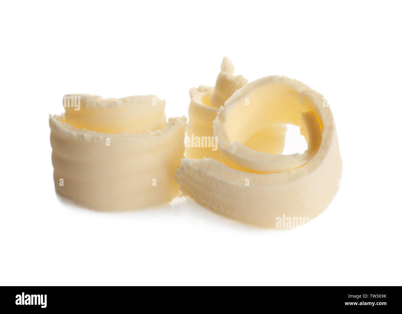 Delicious butter curls on white background, closeup Stock Photo - Alamy
