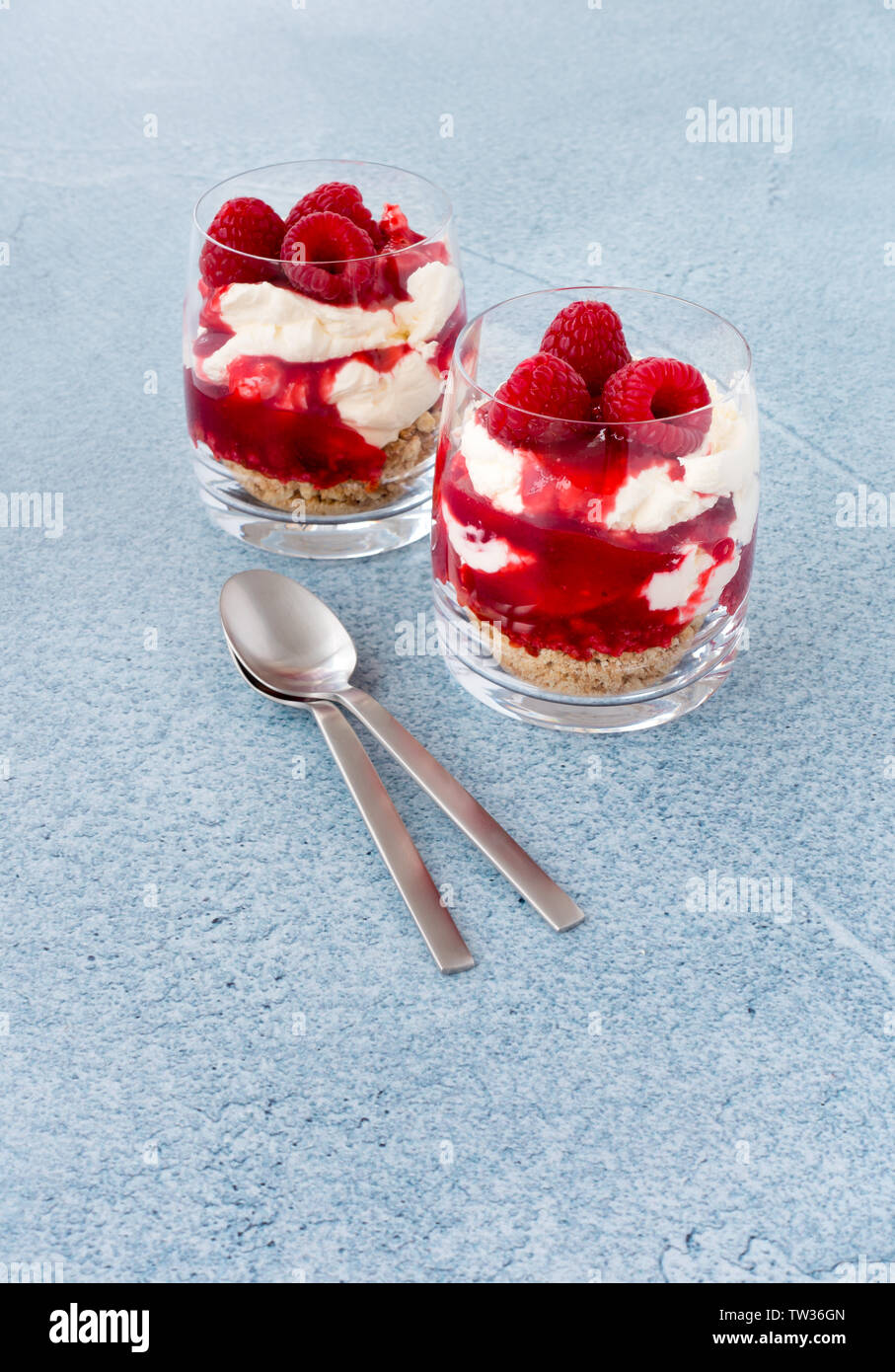 Raspberry dessert with fresh raspberries, sauce, whipped cream and ...