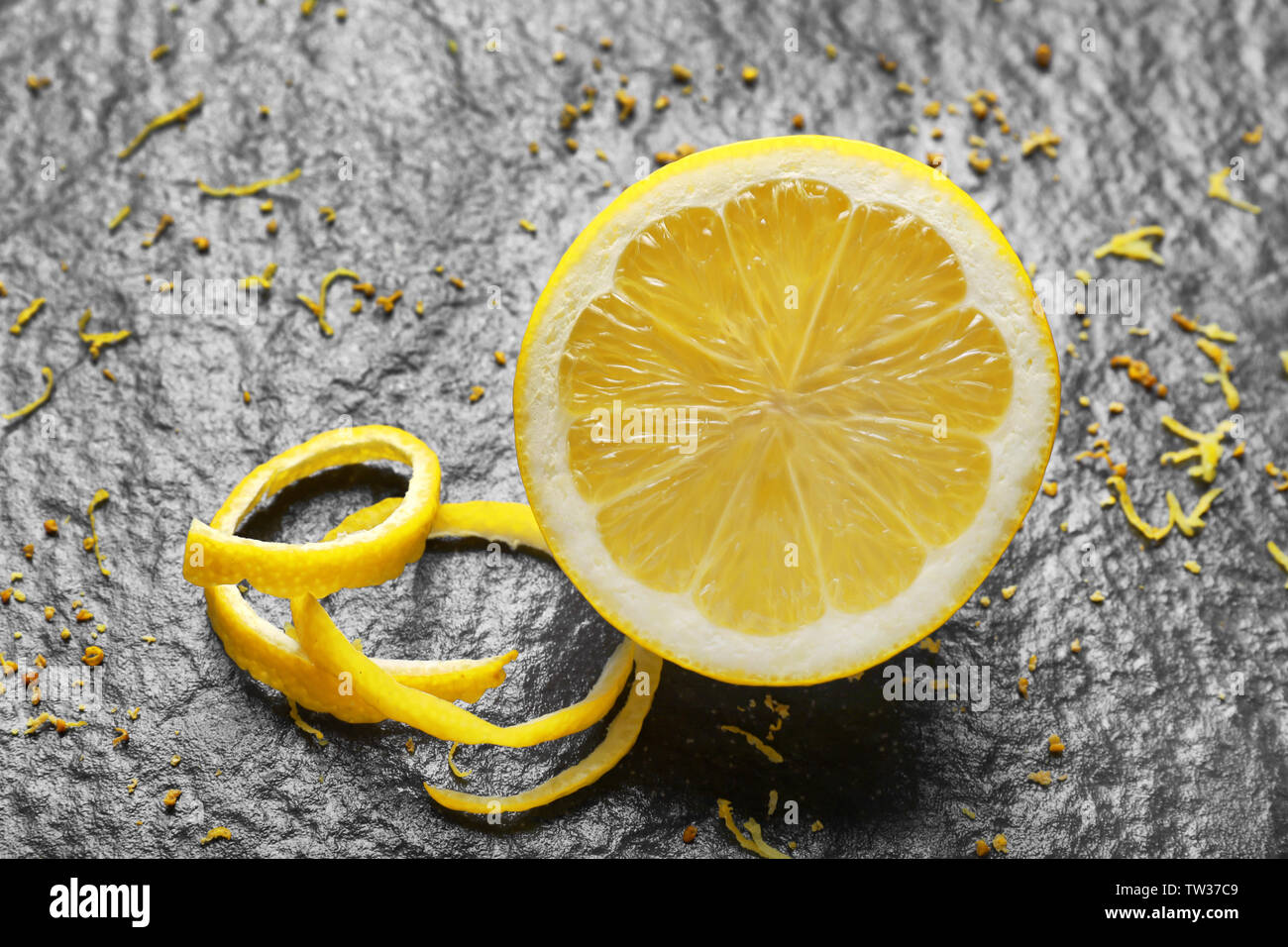 Half of fresh lemon on dark background Stock Photo - Alamy