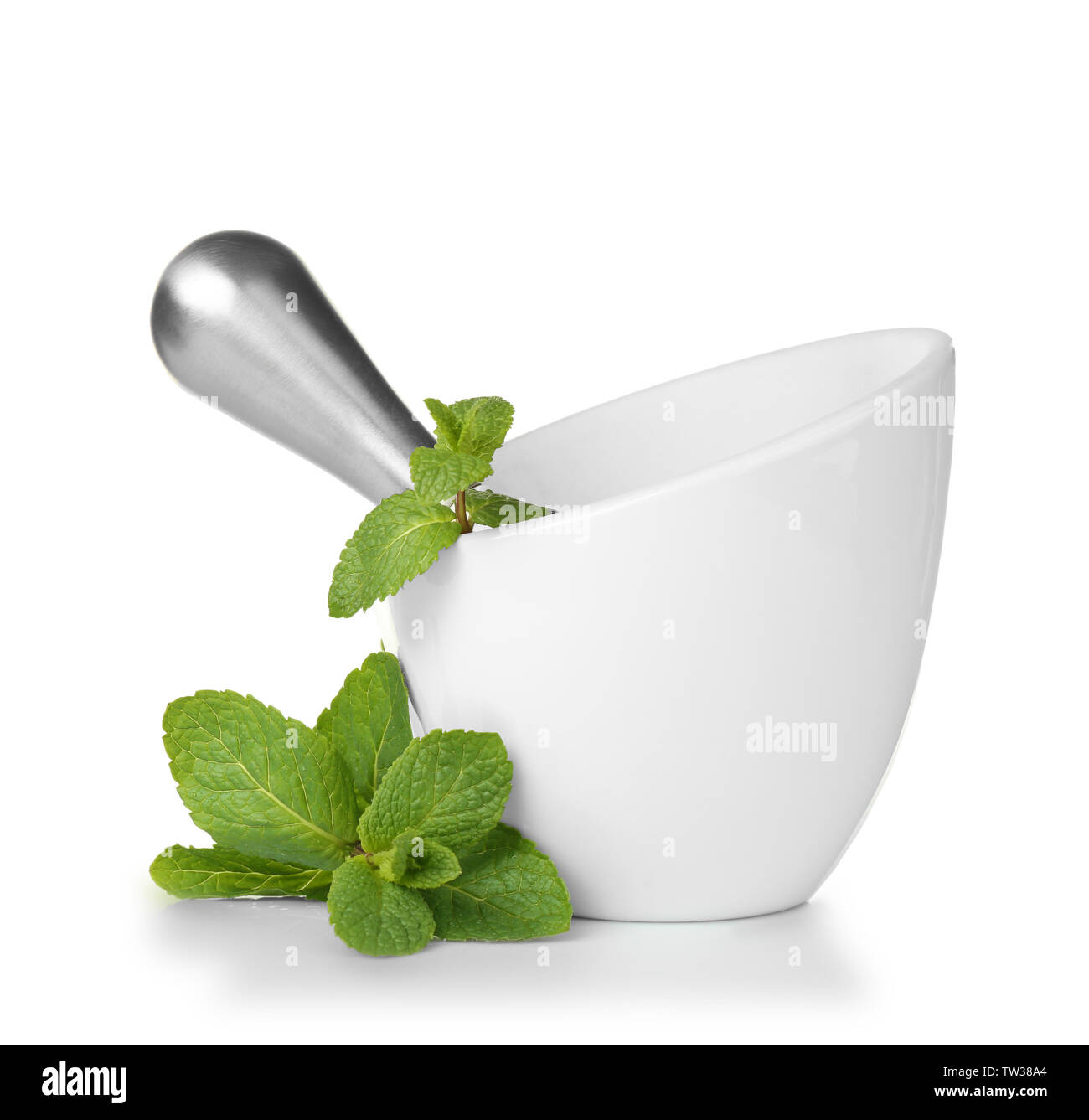 Mortar with lemon balm on white background Stock Photo - Alamy