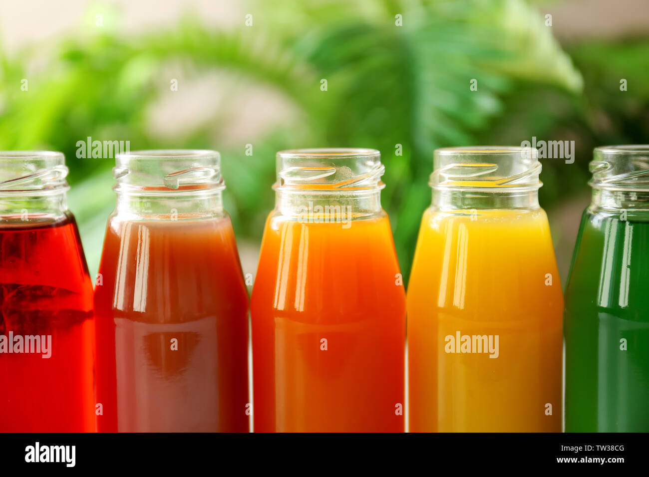 Delicious juices in bottles, closeup Stock Photo - Alamy