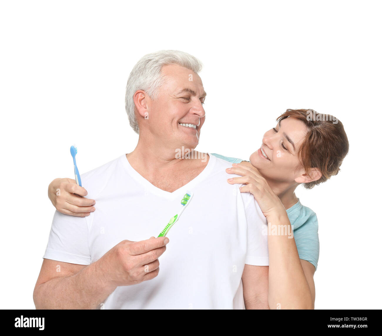 Senior couple with toothbrushes on white background Stock Photo - Alamy