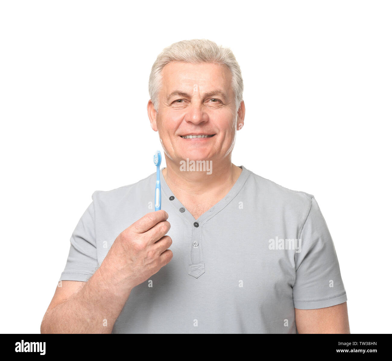 Senior man with toothbrush on white background Stock Photo - Alamy