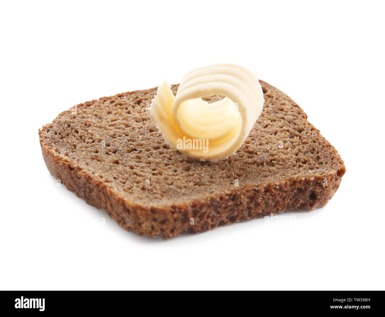 Slice of bread with butter curl on white background Stock Photo - Alamy