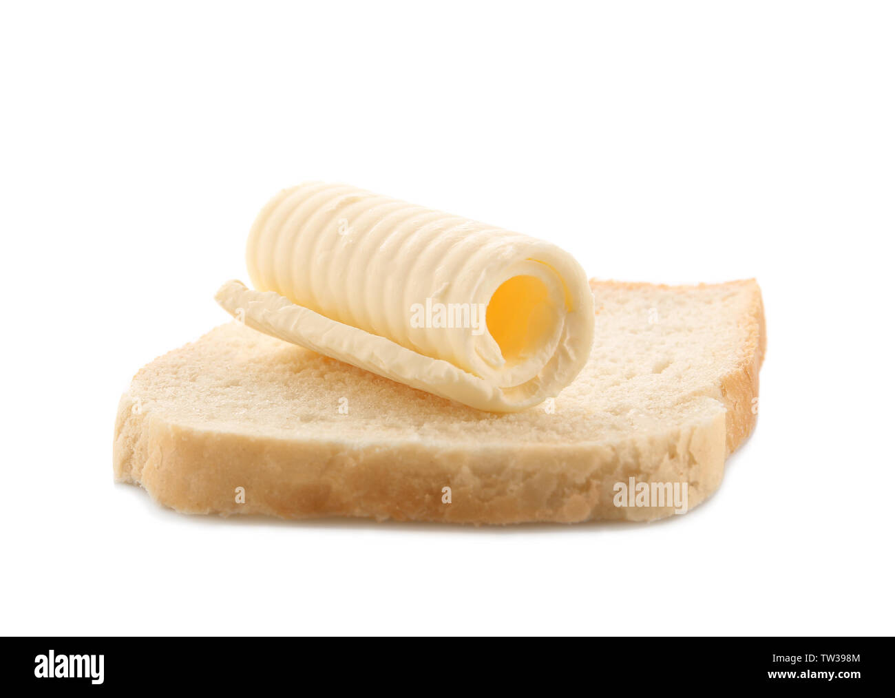 Slice of bread with butter curl on white background Stock Photo - Alamy