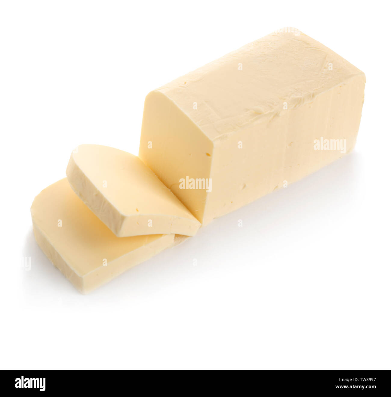 Cut piece of butter on white background Stock Photo - Alamy