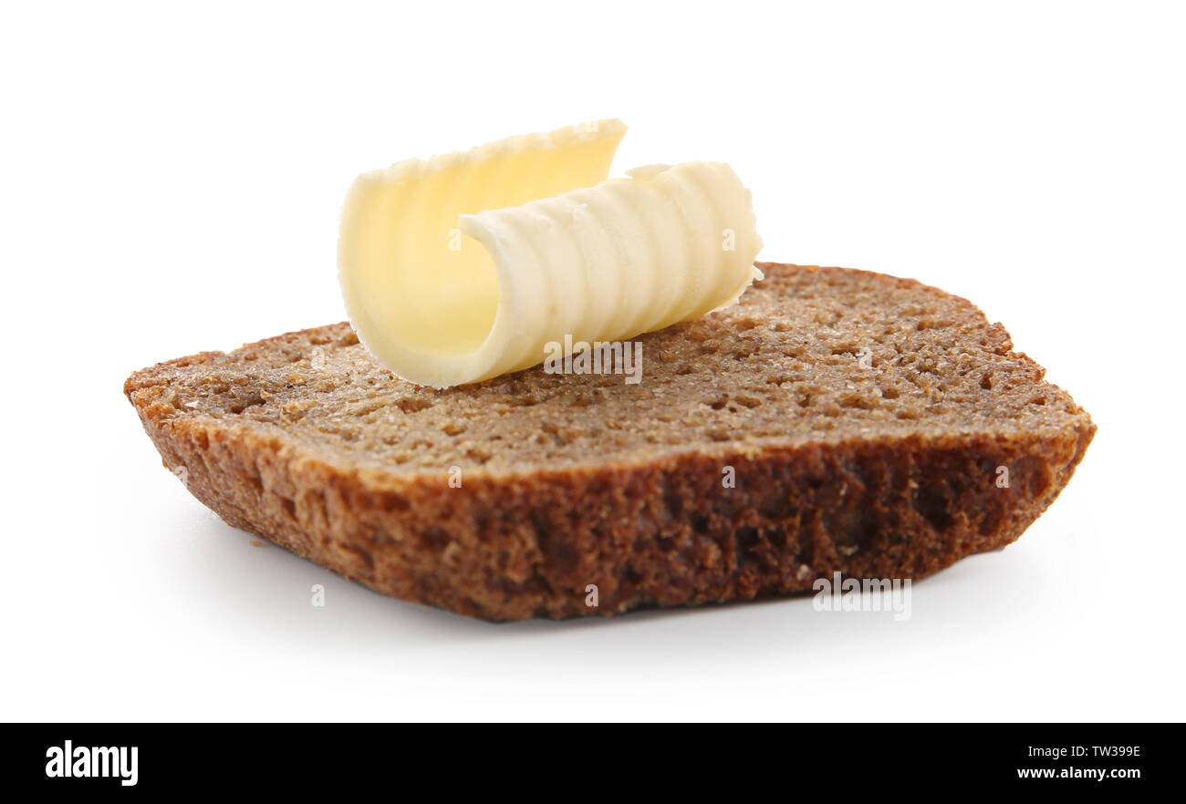 Slice of bread with butter curl on white background Stock Photo - Alamy