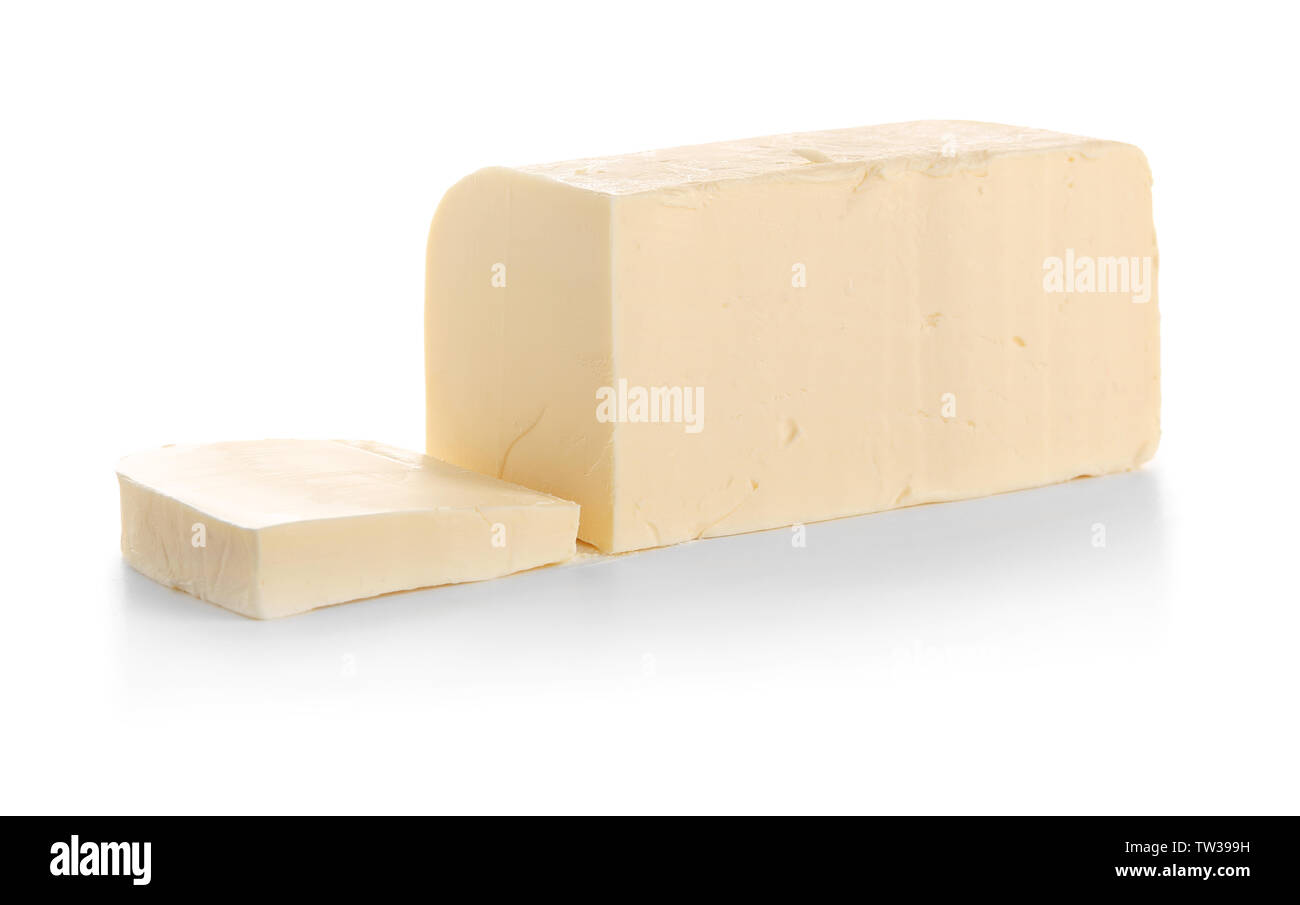 Cut piece of butter on white background Stock Photo - Alamy