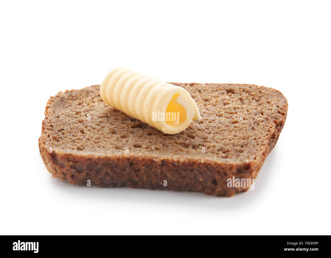 Slice of bread with butter curl on white background Stock Photo - Alamy