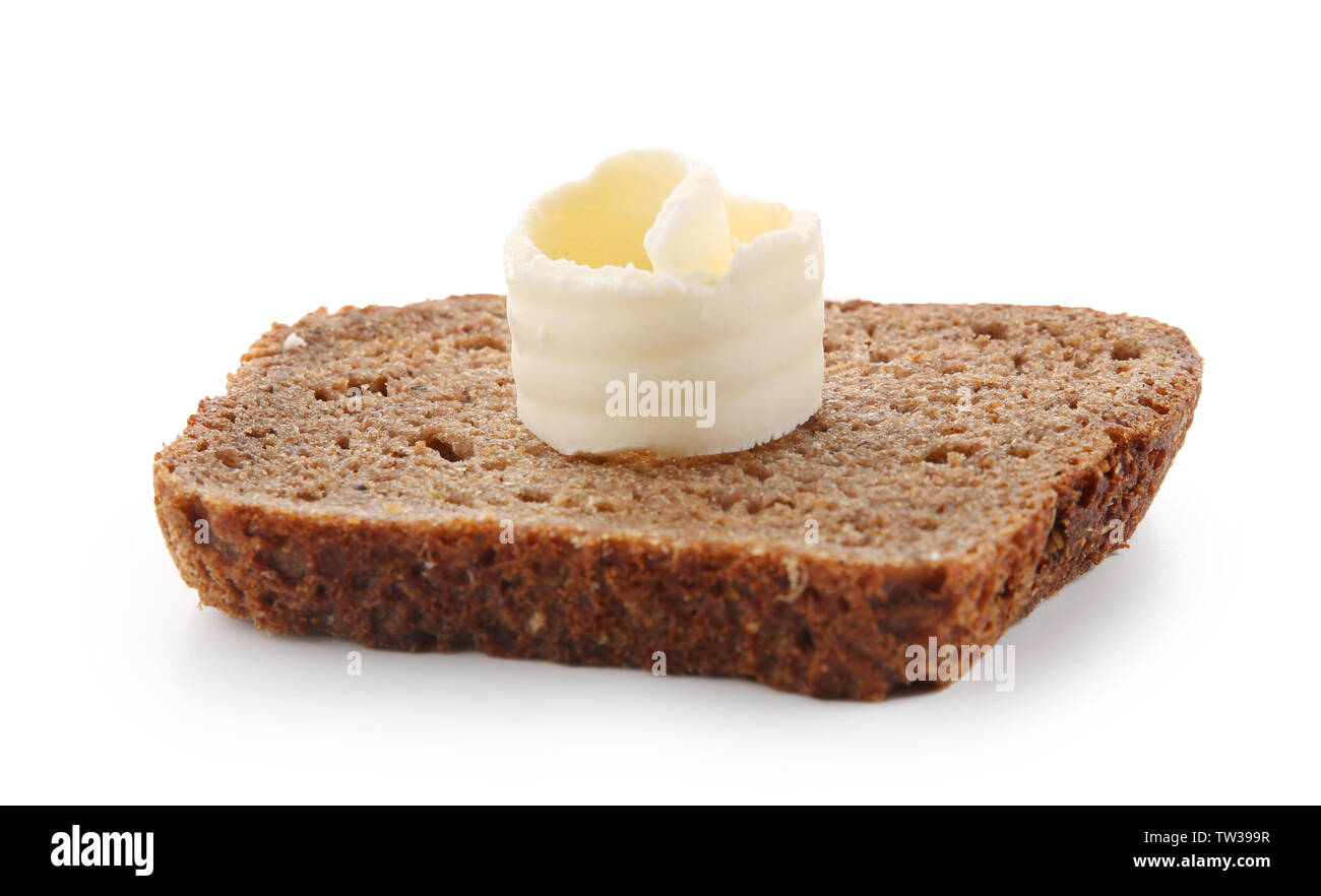Slice of bread with butter curl on white background Stock Photo - Alamy