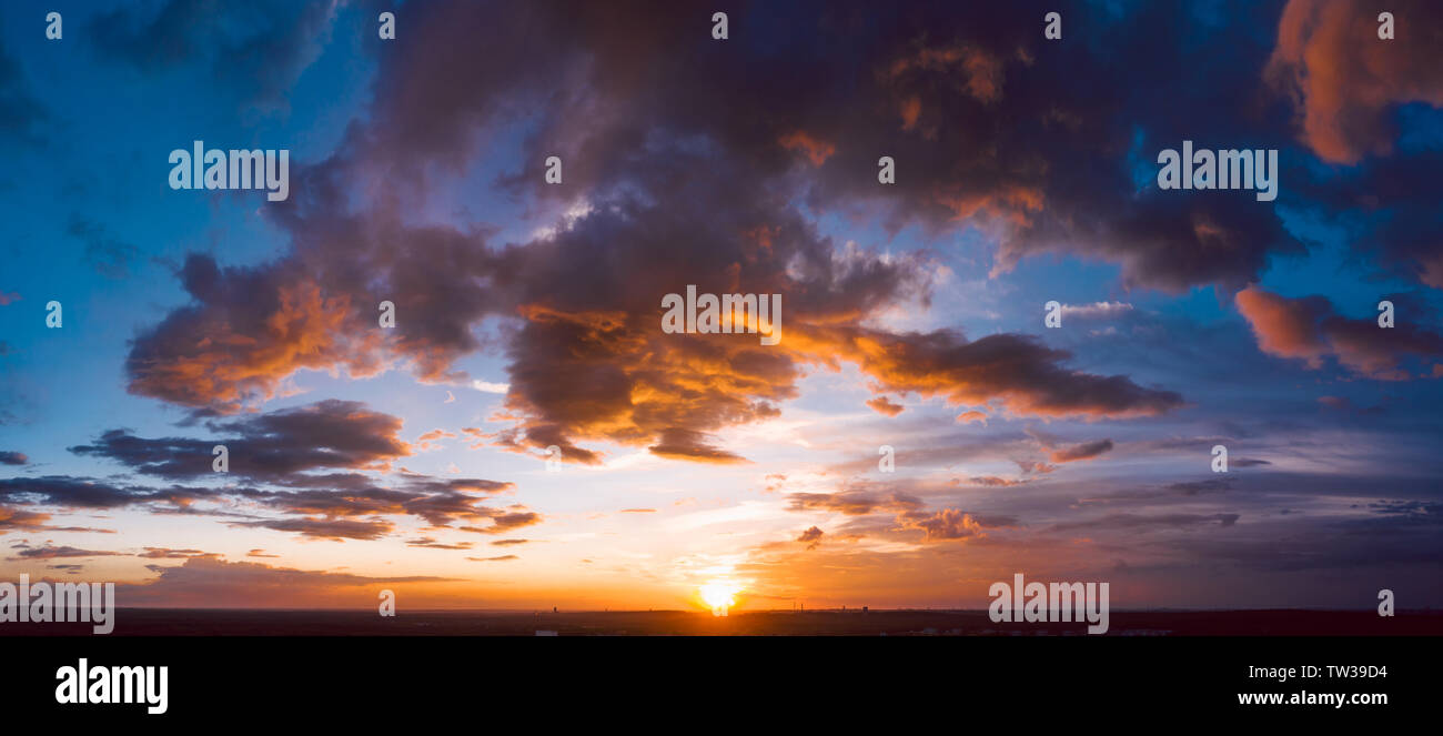 Dramatic orange sky with clouds at sunset Stock Photo - Alamy