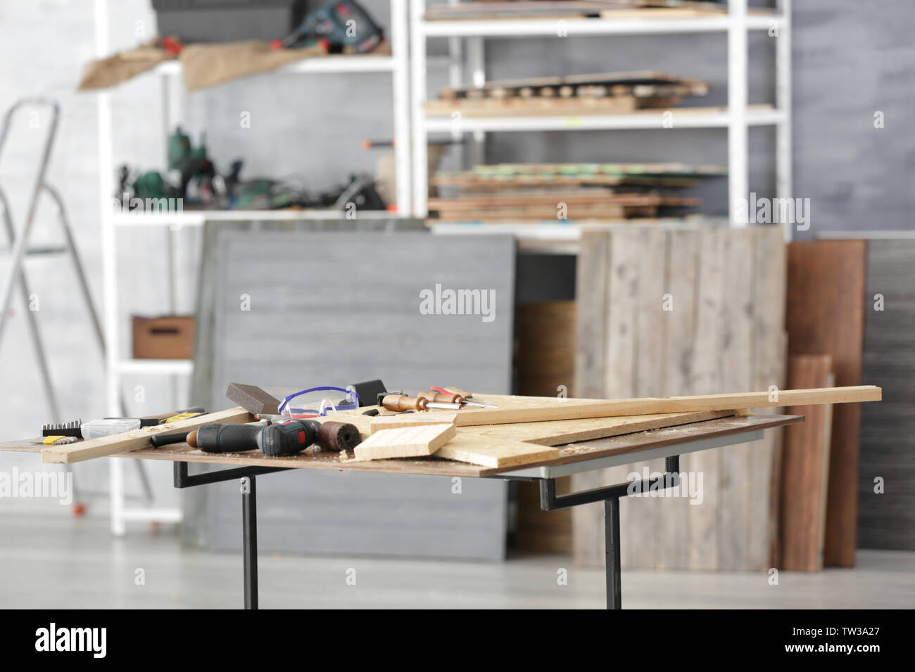 Table with tools in carpenter's workshop Stock Photo - Alamy