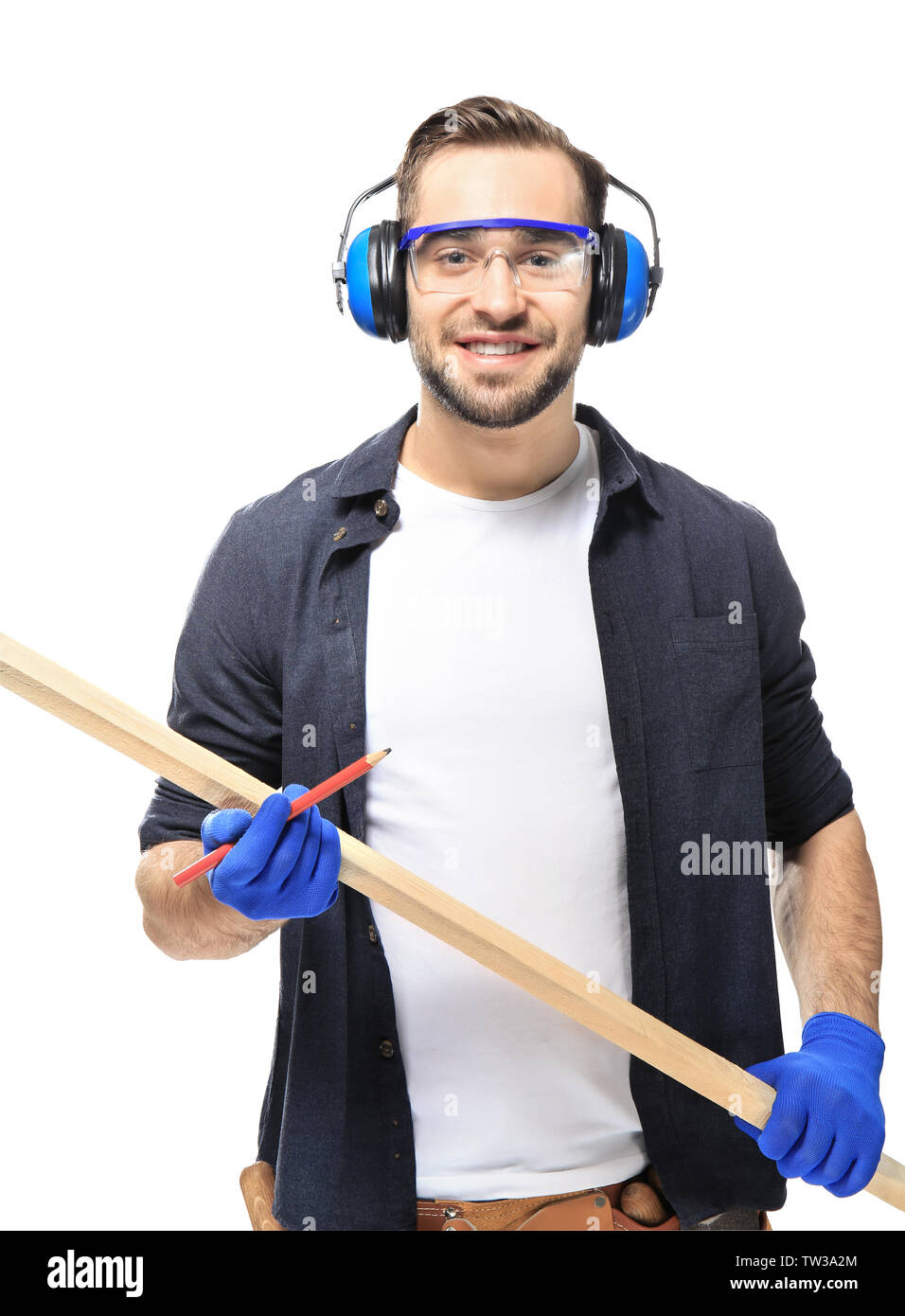Smiling carpenter holding wooden plank hi-res stock photography and ...
