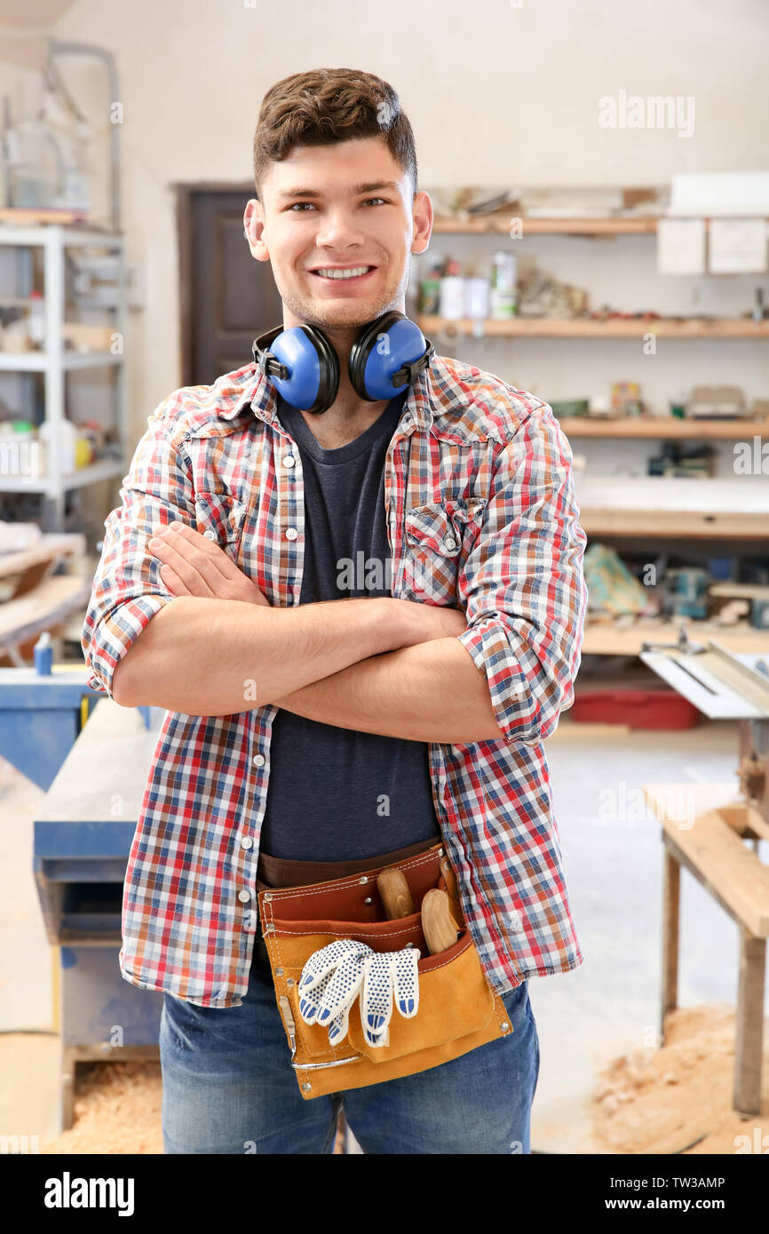 Handsome young carpenter arms hi-res stock photography and images - Alamy