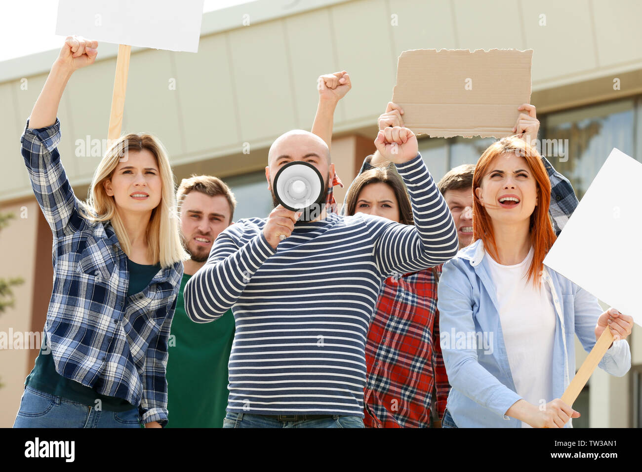 Group of protesting young people on street Stock Photo - Alamy