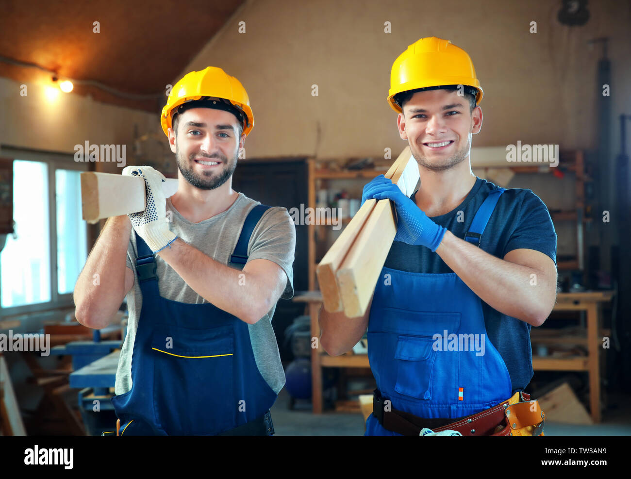 Handsome young carpenter boards hi-res stock photography and images - Alamy