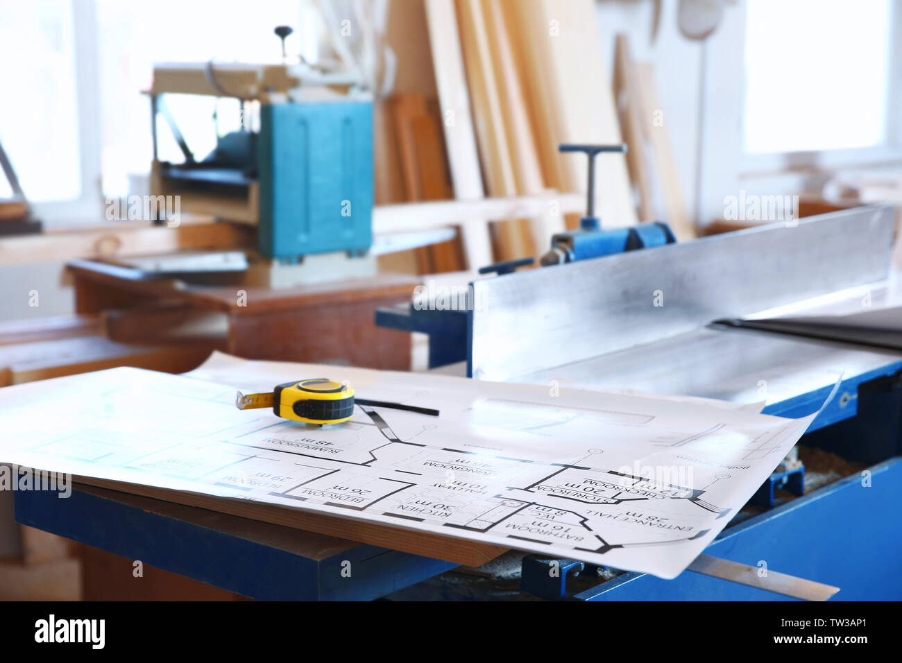 Table with drawing in carpenter's workshop Stock Photo - Alamy